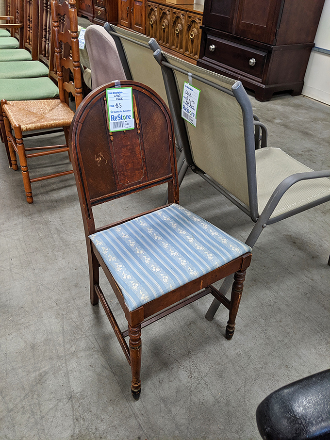 That vintage wooden chair with its blue striped seat isn't just furniture&mdash;it's a conversation piece with decades of dinner discussions in its grain.