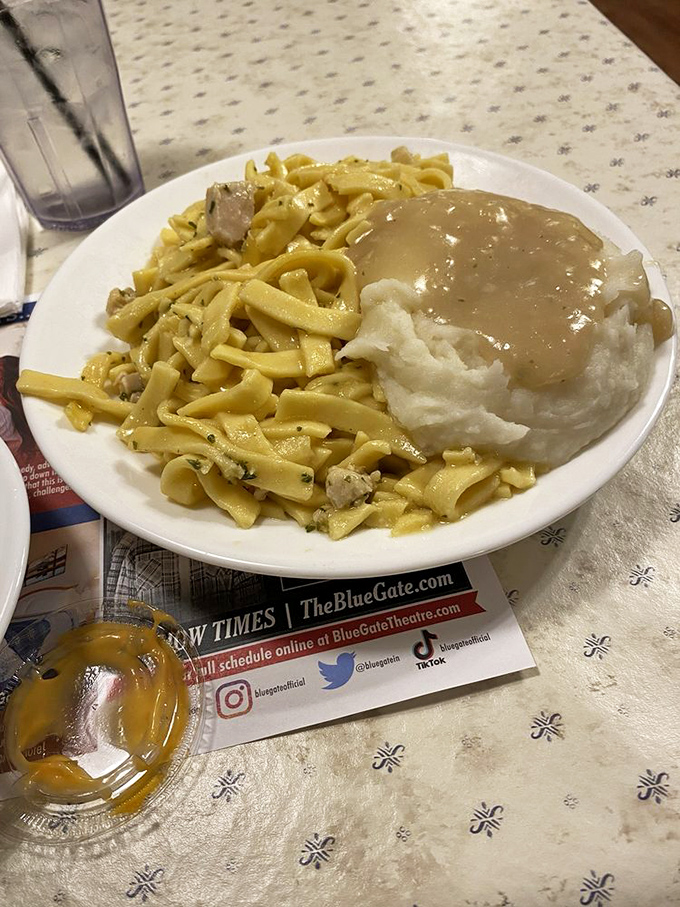 Chicken and noodles swimming in savory goodness alongside mashed potatoes. Carb-counters beware&mdash;this is worth every delicious calorie.