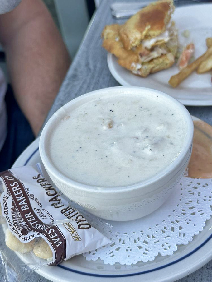 A bowl of creamy clam chowder that could make a New Englander homesick, served with oyster crackers for the authentic experience.
