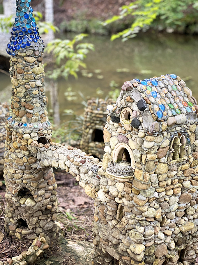 Blue marbles and careful stonework create a riverside retreat that proves creativity flows like water when passion meets patience.