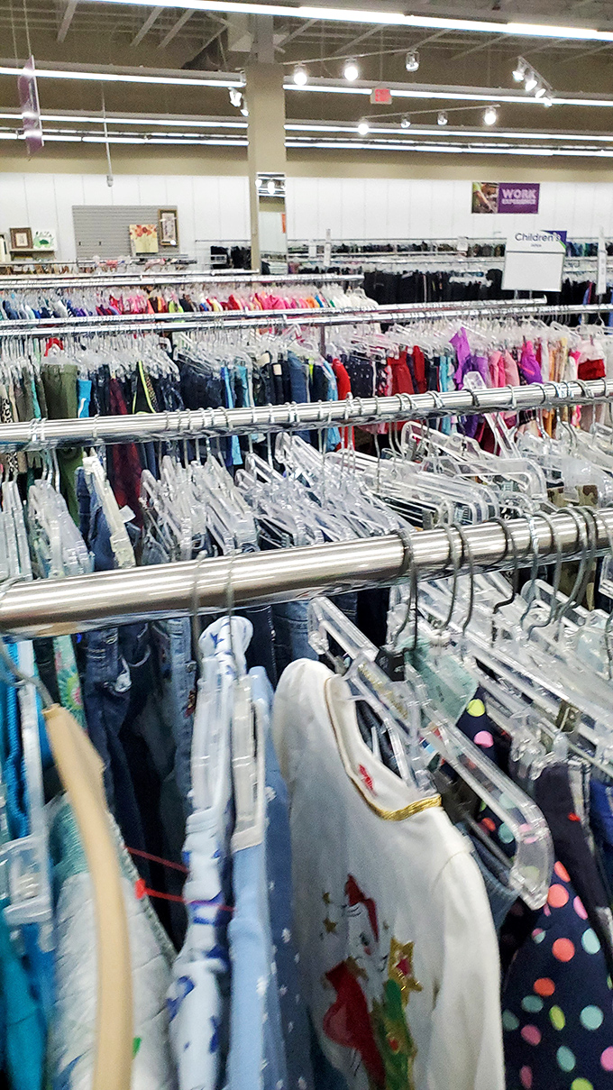 Children's clothing racks organized by color make finding that perfect outfit easier than herding actual cats.