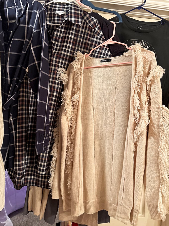 Plaid shirts and fringed cardigans hang in perfect harmony&mdash;like a fashion potluck where everyone brought their A-game.