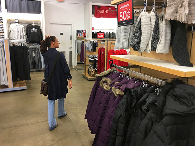 A shopper contemplates winter coats in Alabama&mdash;an optimistic purchase given the state's brief acquaintance with actual winter temperatures.
