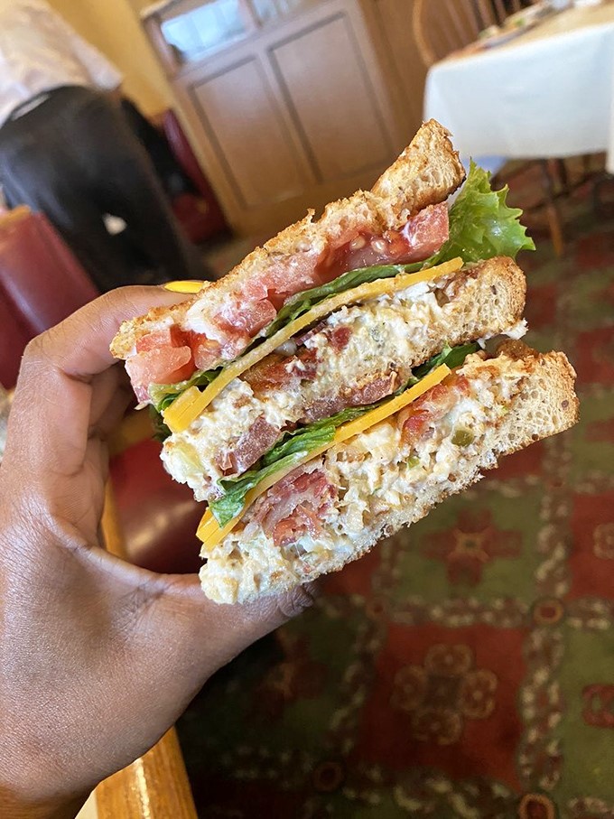 A sandwich so perfectly stacked it deserves its own architectural award. That's not lunch; that's edible engineering.