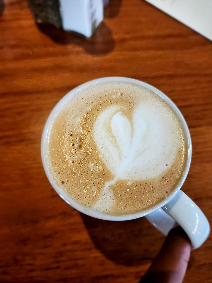 Latte art so pretty you almost don't want to drink it. Almost. That heart-shaped foam is whispering sweet caffeinated nothings to your soul.