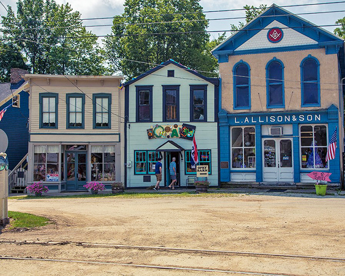 The L. Allison & Son building stands proudly alongside its neighbors, its blue trim and Masonic symbol hinting at stories that span generations of Hoosier history.