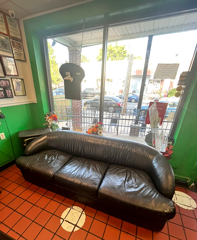 The well-worn leather couch speaks volumes: people come for the chicken but stay for the community. A true neighborhood landmark.