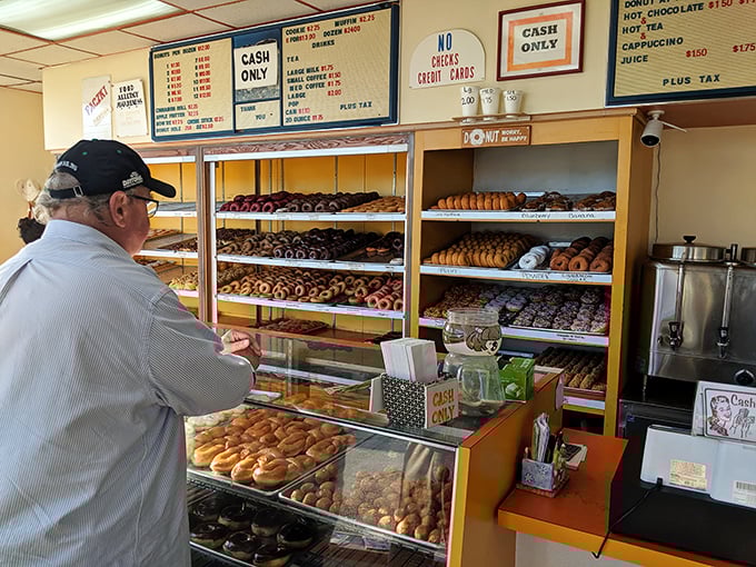 The counter where dreams come true and diets go to die. Notice the "Cash Only" sign&mdash;some traditions never change.