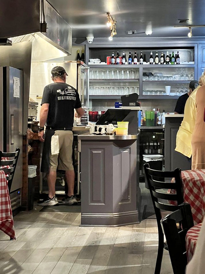 The bar area isn't just functional&mdash;it's command central for an operation that takes steak more seriously than most people take their careers.