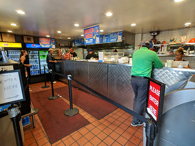 The counter at John's isn't just a barrier&mdash;it's a stage where sandwich artistry happens before an appreciative audience.
