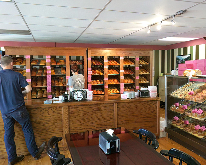 At the counter, pastry paradise awaits as shelves of freshly baked goods stand at attention, ready to report for delicious duty.