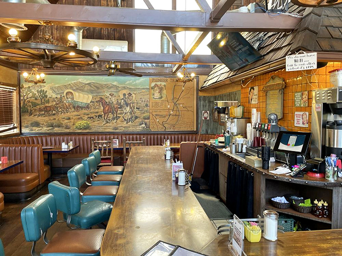 The counter seating area feels like a time capsule from Route 66's heyday, complete with vintage decor and a mural that tells stories of pioneers past.
