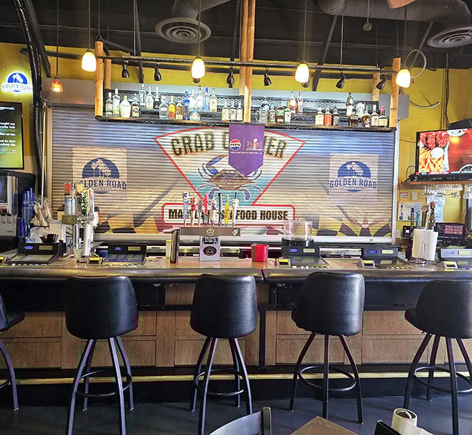 The bar where strangers become friends over crab stories. Notice the TVs – perfect for watching the game while attacking your seafood.