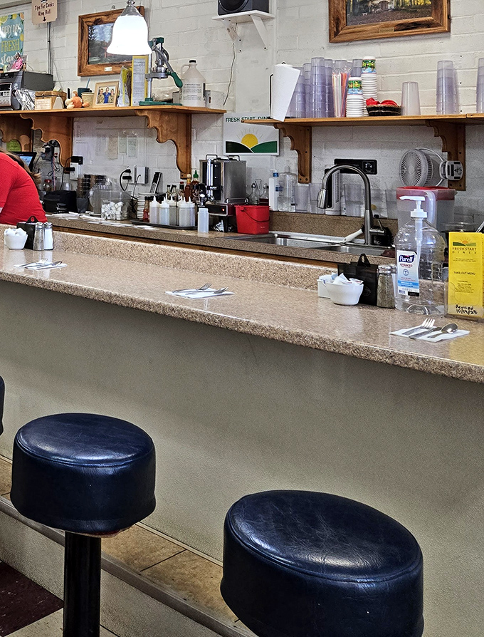 The counter seating – where solo diners become temporary members of the breakfast club and coffee refills arrive before you ask.