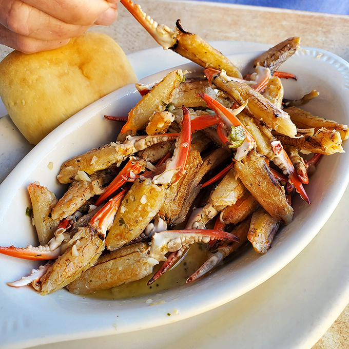 Garlic butter crab claws require work, but the sweet reward inside those shells makes every crack and pull absolutely worth the effort.
