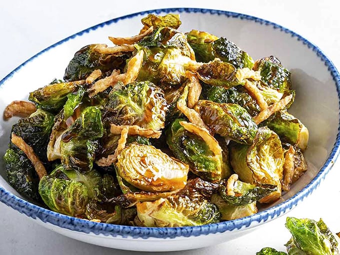 Brussels sprouts that could convert vegetable skeptics. Crispy, caramelized edges with savory depth that might steal attention from the seafood stars.