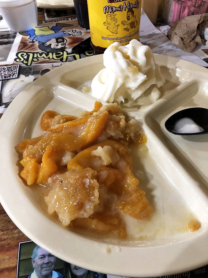 Peach cobbler with ice cream melting into warm, buttery crevices&mdash;the kind of dessert that makes you consider licking the plate when nobody's looking.