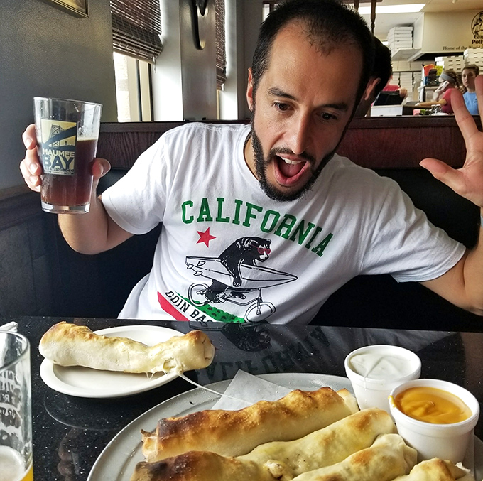 The face of pure joy that only comes from that first magical bite of a cheese-filled breadstick. This is what food happiness looks like.