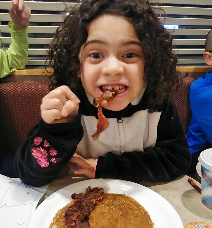 The dining room buzzes with the beautiful symphony of forks against plates and genuine conversation – the soundtrack of a true community gathering place.