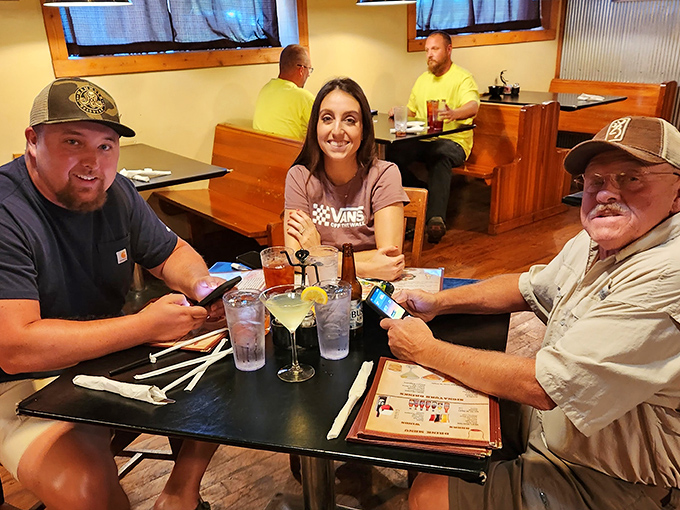 Happy diners proving that good food is the universal language of contentment and loosened belt buckles.
