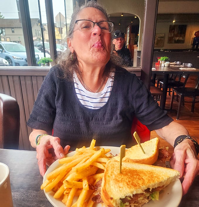 The joy of diner food is written all over this patron's face. That sandwich clearly understands the assignment: make humans happy.