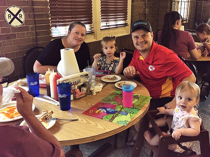The true measure of a great barbecue joint: families making memories around tables where sauce-stained napkins tell stories of satisfaction.