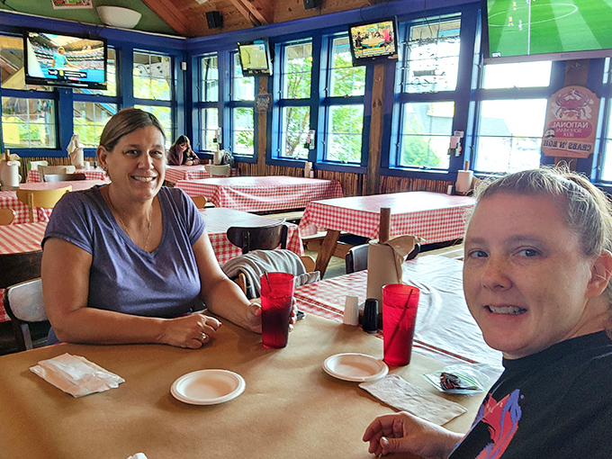 Happy diners at the ready, paper plates standing by. The calm before the delicious storm of cracking, picking, and inevitable finger-licking.
