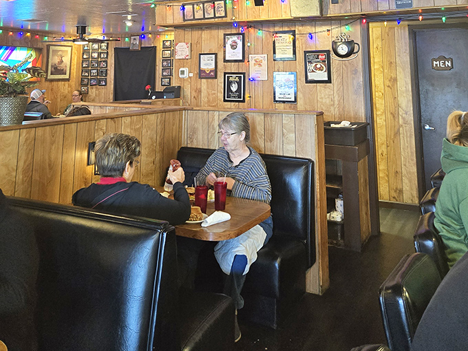 The best conversations happen in booths like these, where coffee flows freely and breakfast decisions are debated with Olympic seriousness.
