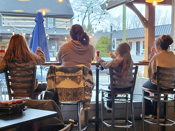 Window seats: where coffee meets people-watching. The best conversations happen over steaming mugs and plates licked clean.