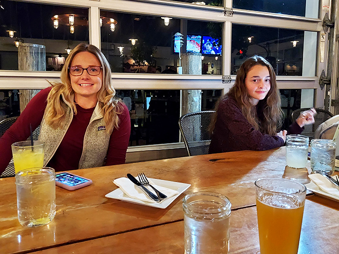 Happy diners enjoying drinks with a view. When the food arrives, those smiles will only get bigger&mdash;seafood has that effect on people.
