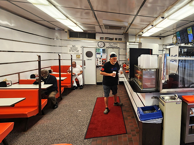 The narrow dining area buzzes with the energy of regulars and first-timers alike, all united in the universal language of "mmm" and "pass the ketchup."