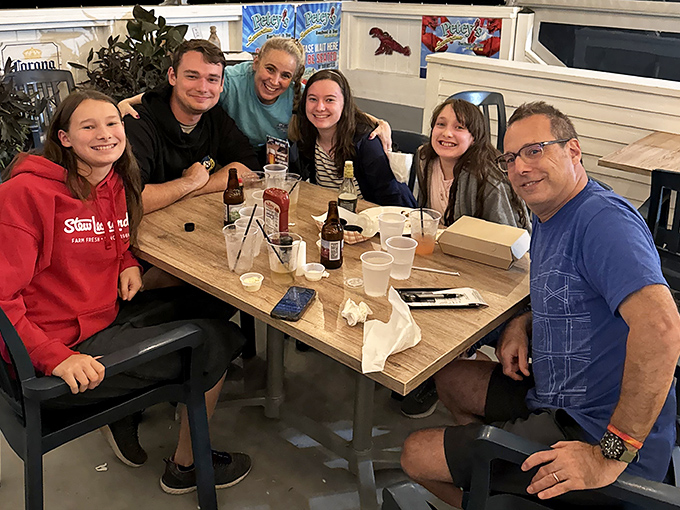 Happy faces around the table tell the real story—Petey's isn't just about great food, it's about creating memories that last longer than the meal.