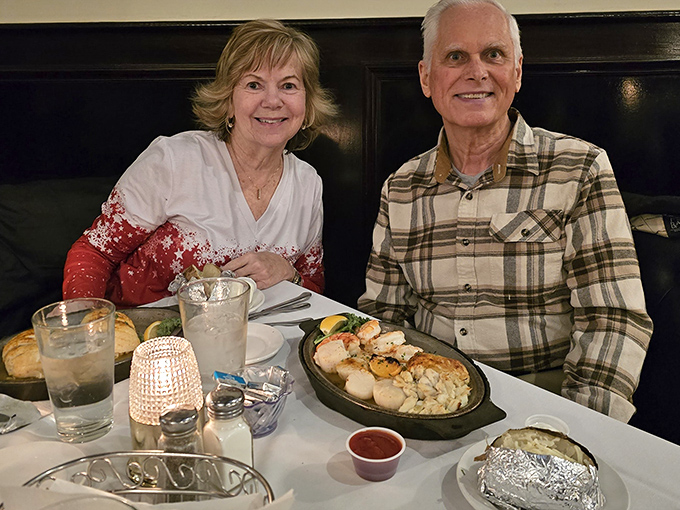 Happy diners enjoying the fruits of the sea. That seafood platter isn't just a meal—it's the centerpiece of memories being made.