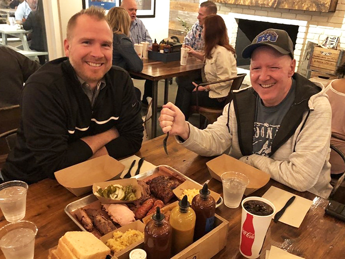 Happy faces around a tray of barbecue – the universal expression of people who've just discovered meat nirvana in the Arizona desert.