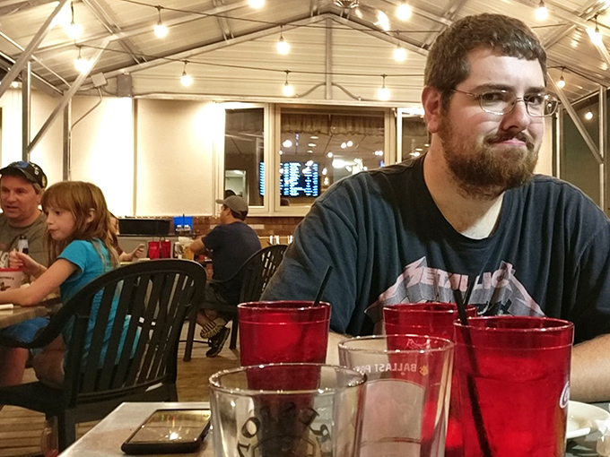 The dining area buzzes with the universal language of good food&mdash;notice how nobody's looking at their phones when there's pizza around.
