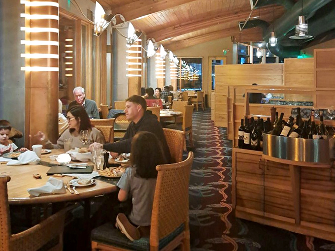 Warm wood tones and happy diners create the kind of atmosphere where celebrations feel natural.