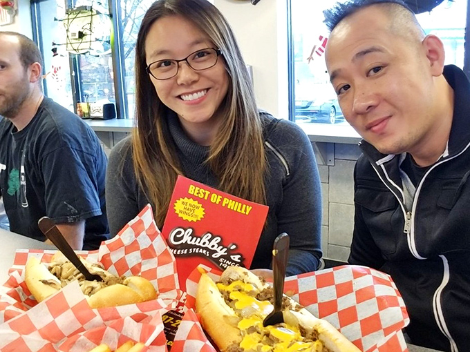 The universal language of cheesesteak appreciation knows no boundaries. These happy faces tell the whole delicious story.