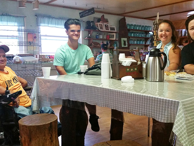 The counter where dreams come true and diets go to die. That checkered tablecloth has witnessed more food joy than most five-star restaurants.