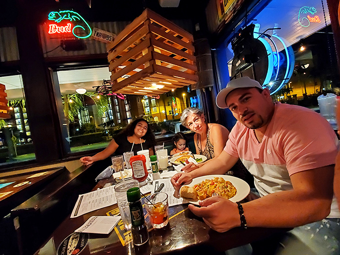 Where families create memories one bite at a time. The neon glow adds just the right amount of Florida kitsch to dinner.