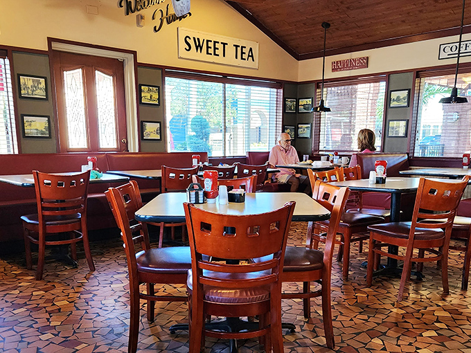 The dining room where strangers become neighbors over coffee refills. Those "Sweet Tea" and "Happiness" signs aren't just decor—they're promises kept daily.