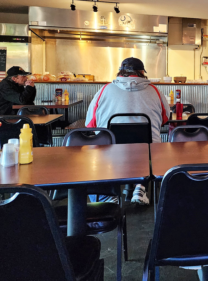 Counter seating where the kitchen action unfolds like dinner theater, minus the drama, plus the sizzle.