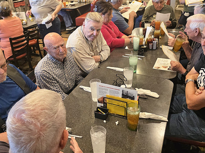 Morning regulars hold court over coffee, solving world problems one breakfast plate at a time.