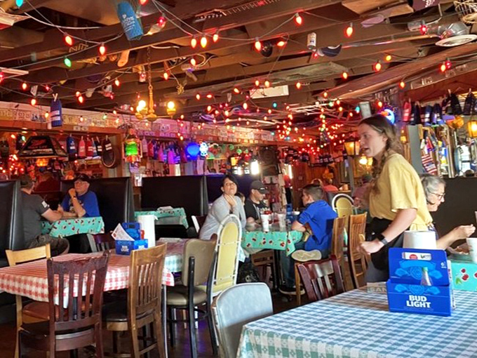 The dining room buzzes with the universal sound of satisfaction - happy people enjoying really good fried chicken together.