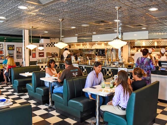 The bustling interior hums with conversation and clinking silverware &ndash; a symphony of satisfaction conducted under pressed tin ceilings.