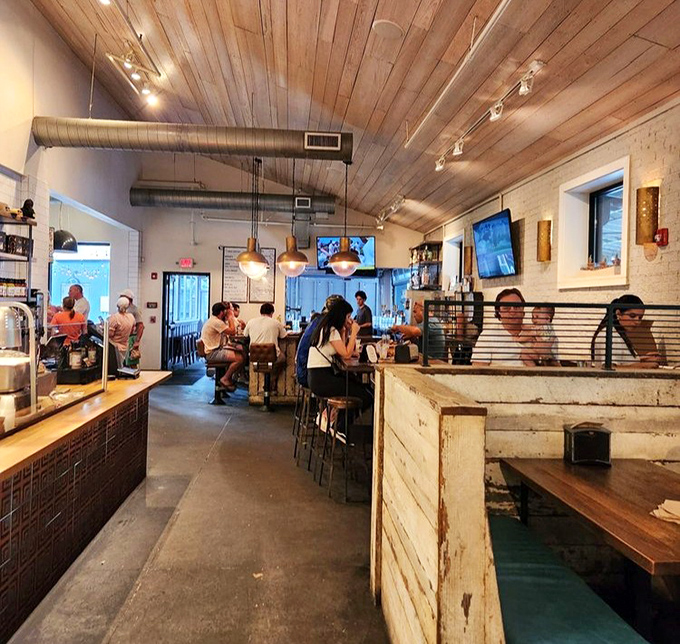 The dining room buzzes with the universal language of "mmm" as wooden ceilings and pendant lights create the perfect backdrop for meat-induced happiness.