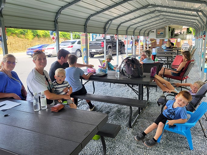 The covered outdoor dining area brings families together over burgers and fries - no phones in sight, just actual conversation.