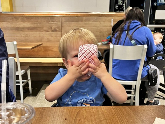 Even the youngest food critics approve&mdash;this little connoisseur is clearly having a religious experience with whatever's behind those hands.