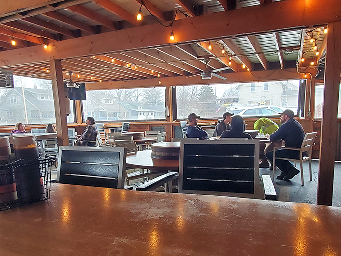 The covered patio offers a front-row seat to Michigan's changing seasons, with the constant being the parade of BBQ platters to tables.