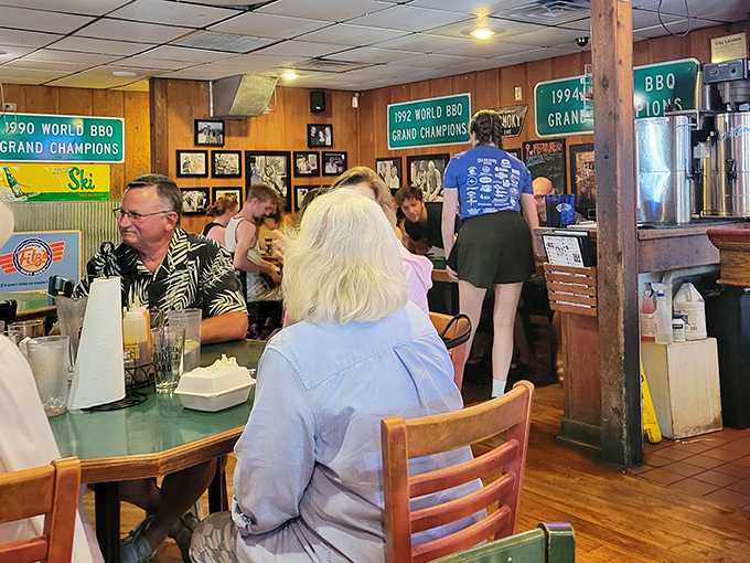 Championship banners from the '90s hang like battle flags, reminding diners they're eating in the presence of barbecue royalty.