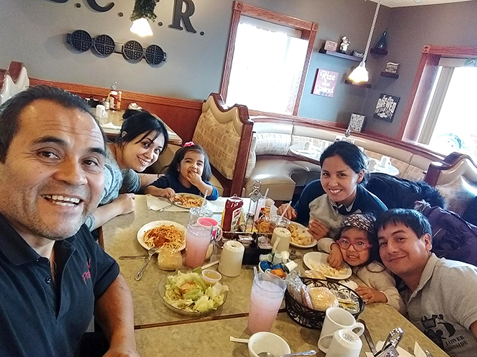 The true measure of a great restaurant: families gathering around tables, creating memories between bites of comfort food classics.